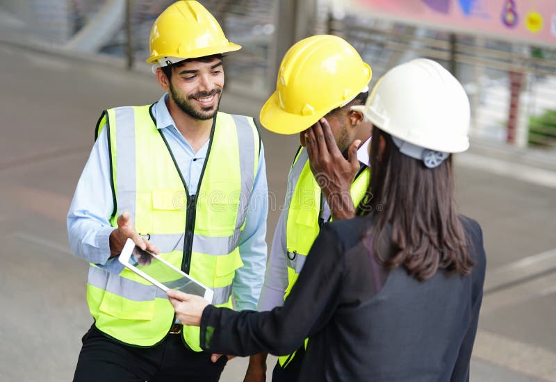 Engineers Team Discussing a Job To Make Decision on Outside Building ...
