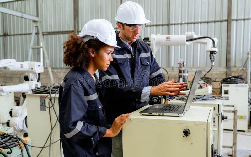 Engineers Technicians Controlling Robotic Arms on Computer Laptop at ...