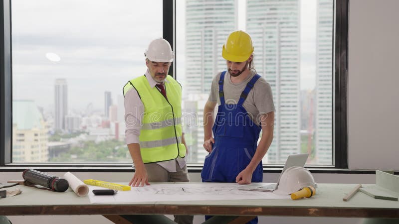 Engineers Using Blueprint of Project Plan Brainstorming and Working ...