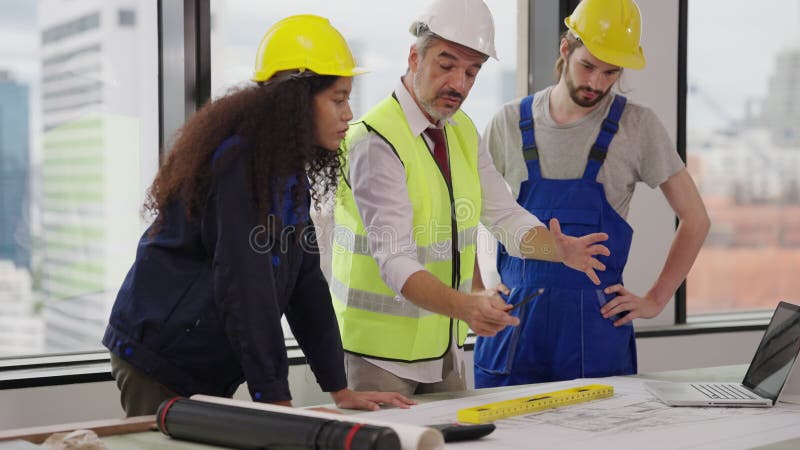Engineers Using Blueprint of Project Plan Brainstorming and Working ...
