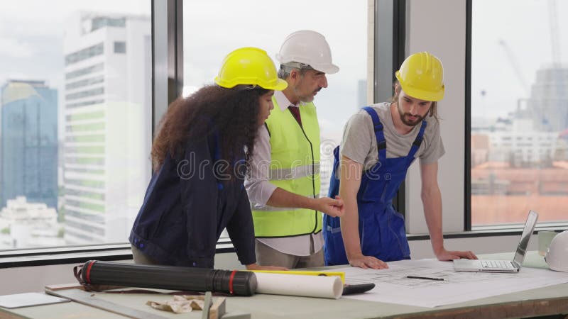 Engineers Using Blueprint of Project Plan Brainstorming and Working ...