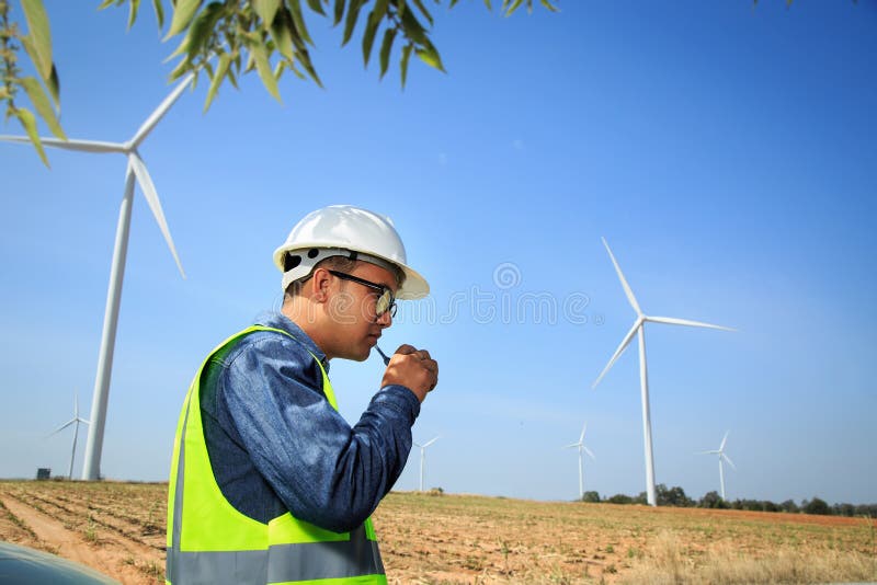 Engineers and Wind Turbines. Stock Image - Image of site, field: 99663499