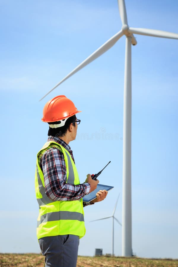 Engineers and Wind Turbines. Stock Photo - Image of tablet, generator ...
