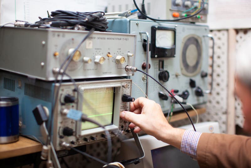 Engineers Work with Electrical Measuring Devices. Stock Image - Image ...
