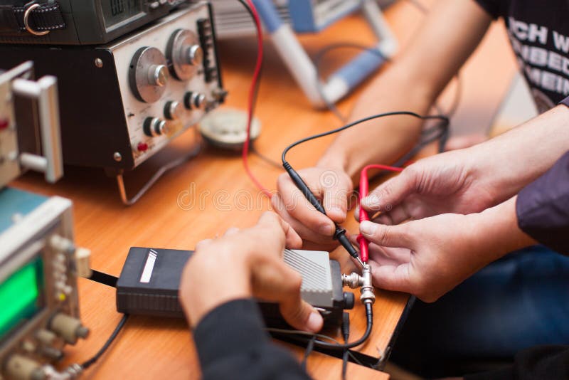 Engineers Work with Electrical Measuring Devices. Stock Image - Image ...