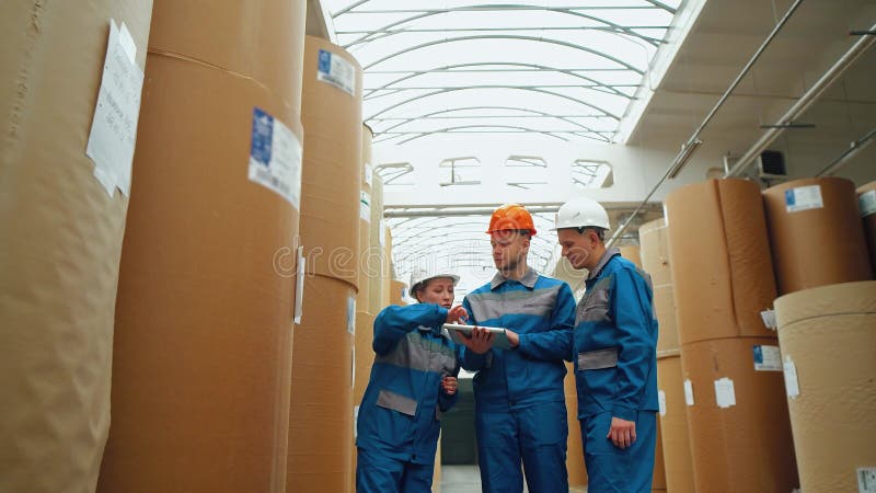Engineers Workers at a Cardboard Box Factory Discuss Supply of Paper ...