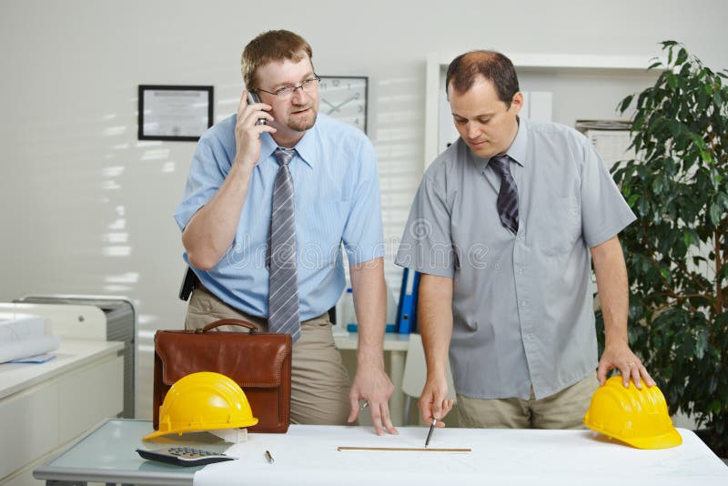 Engineers Talking at Office Stock Image - Image of blueprint ...