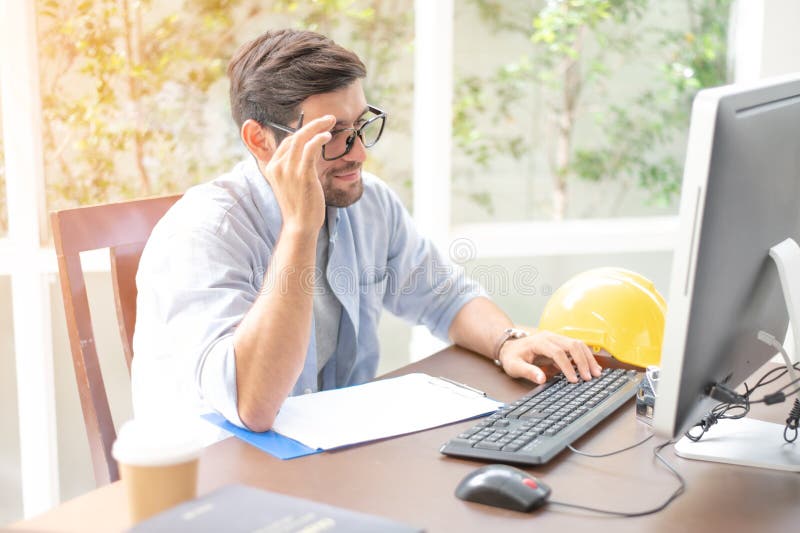 Engineers Working within an Office Using a Computer. Stock Photo ...