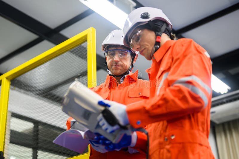 Engineers Working and Solving Problems on Machine at Industrial Plant Stock Image - Image of ...