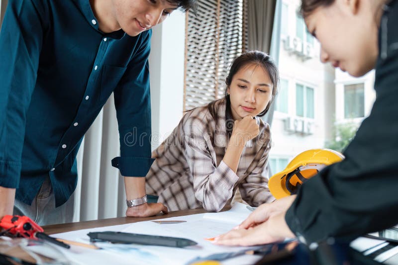 Group of Engineer Collaboration on a Project in a Modern Office Setting ...