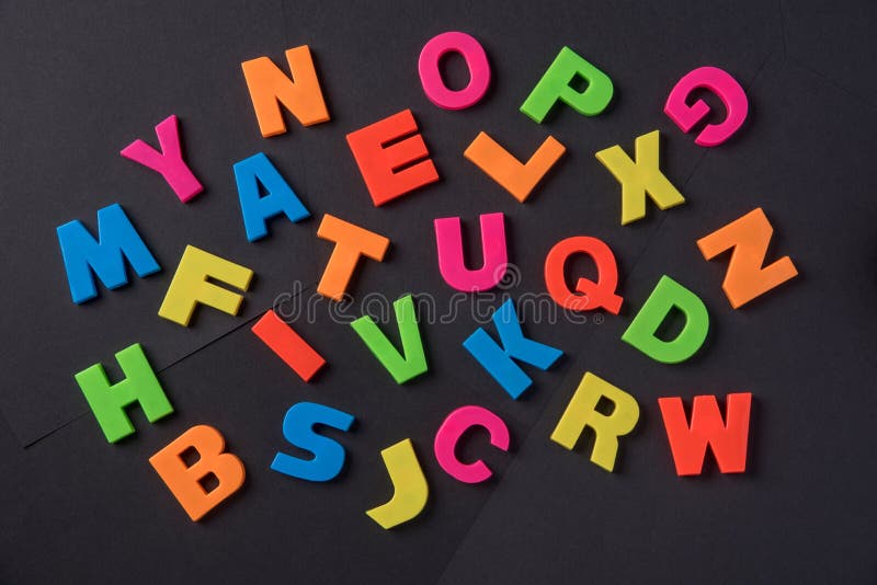 English Alphabet of Letters of Different Colors on a Black Background ...