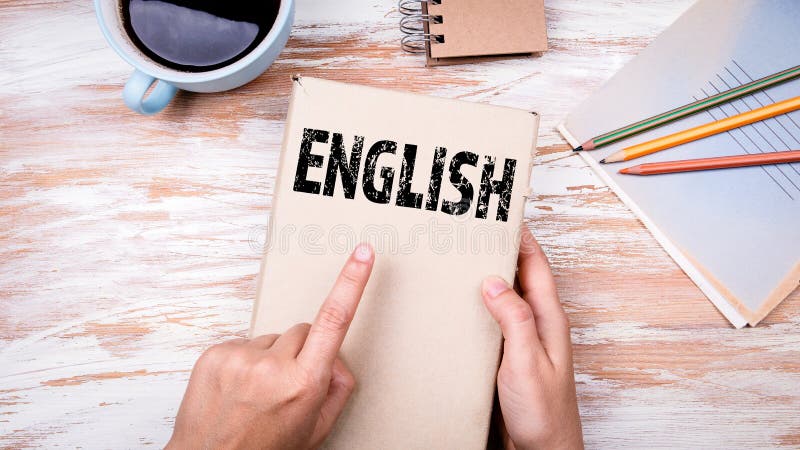 English. Hands Holding Book on Office Table Stock Photo - Image of ...