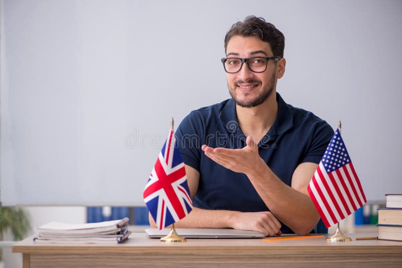 Male English Language Teacher in Front of White Board Stock Photo - Image of books, book: 275481388