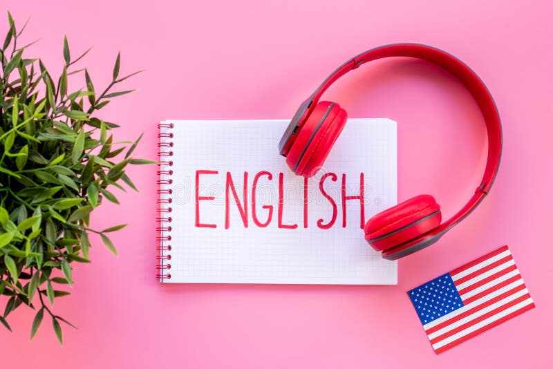 English Lessons Concept. Headpones with Notebook on Student Table Desk ...