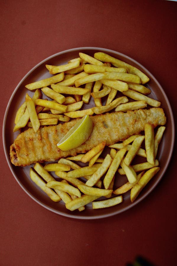 Fish and Chips on a Plate with a Squeeze of Lemon Stock Image - Image ...