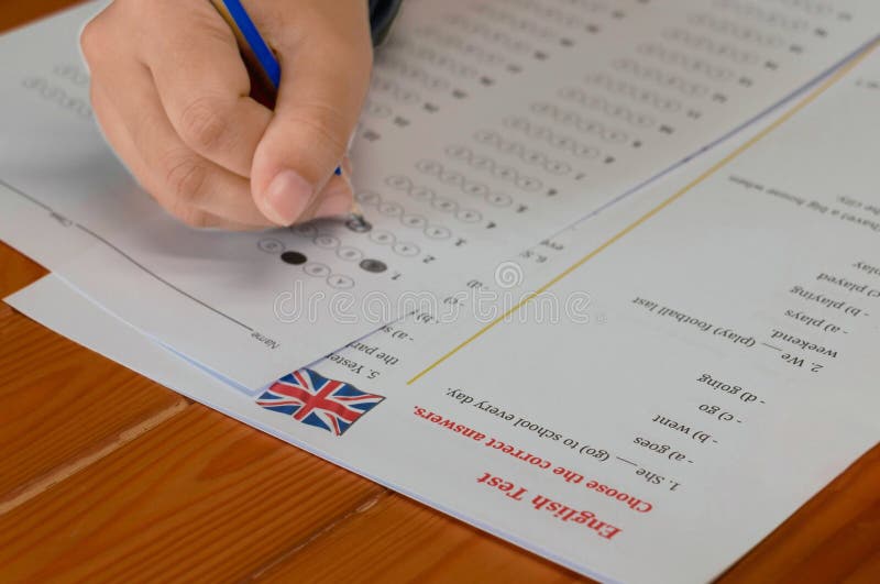English Test and Bubble Answer Sheet on Table in Class Stock Image ...