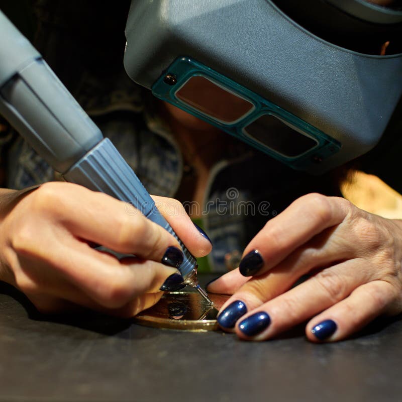 Woman engraver at work. stock image. Image of equipment - 150812121