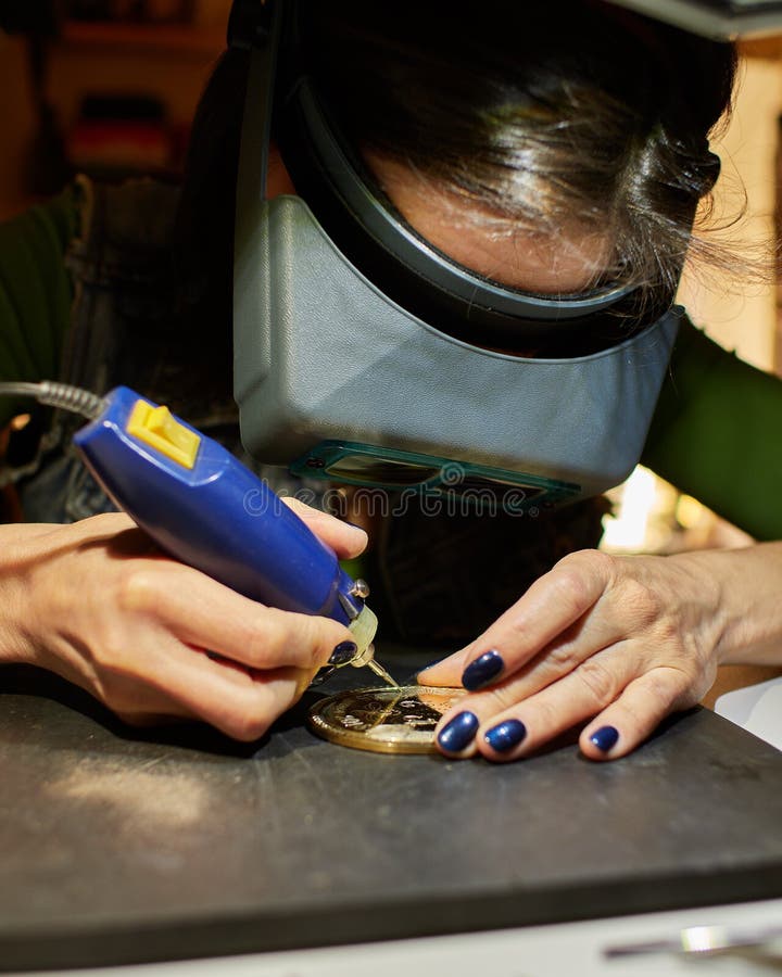 Woman engraver at work. stock photo. Image of copper - 150816922