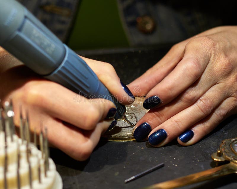 Woman engraver at work. stock image. Image of material - 150820037