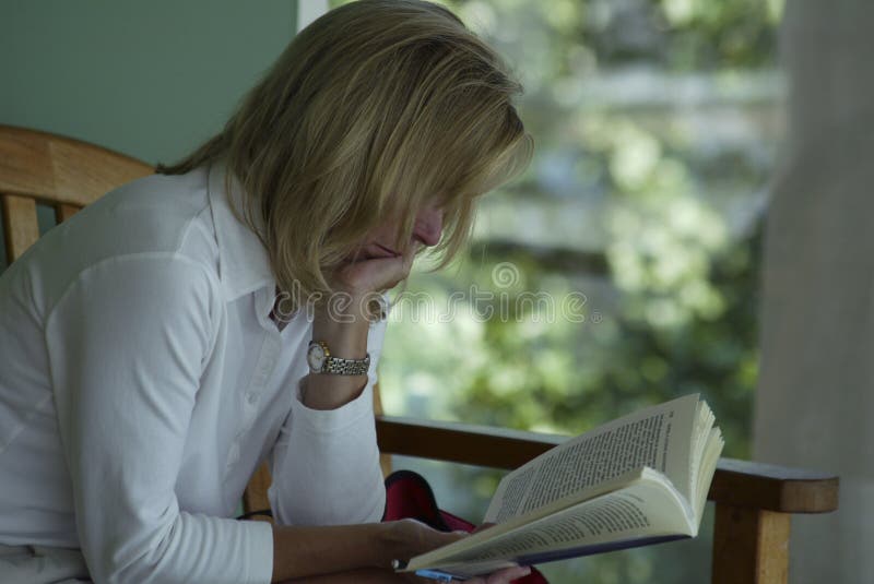 Boy Engrossed while Reading a Book. Stock Photo - Image of light ...