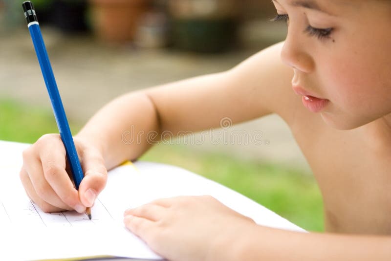 Engrossed in his writing stock image. Image of development - 2725135