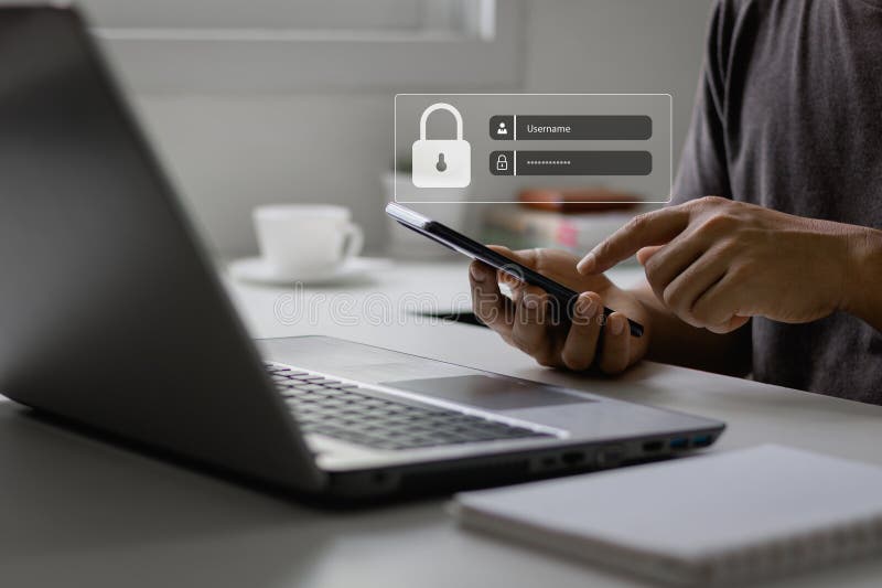 Enhancing Cyber Security in Business. Businessman Using Laptop and Smartphone App for Data ...