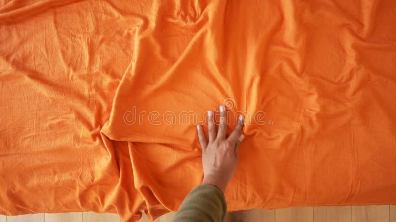 Touching the Texture of an Orange Fabric during a Creative Session ...