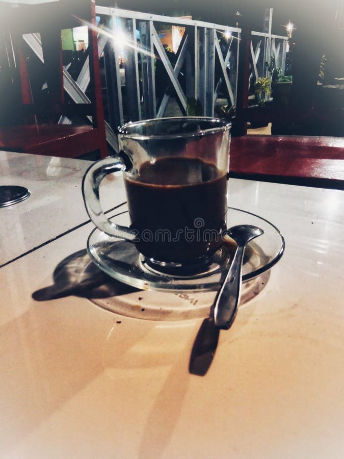 Enjoy a Cup of Coffee at a Coffee Shop at Night Stock Photo - Image of ...