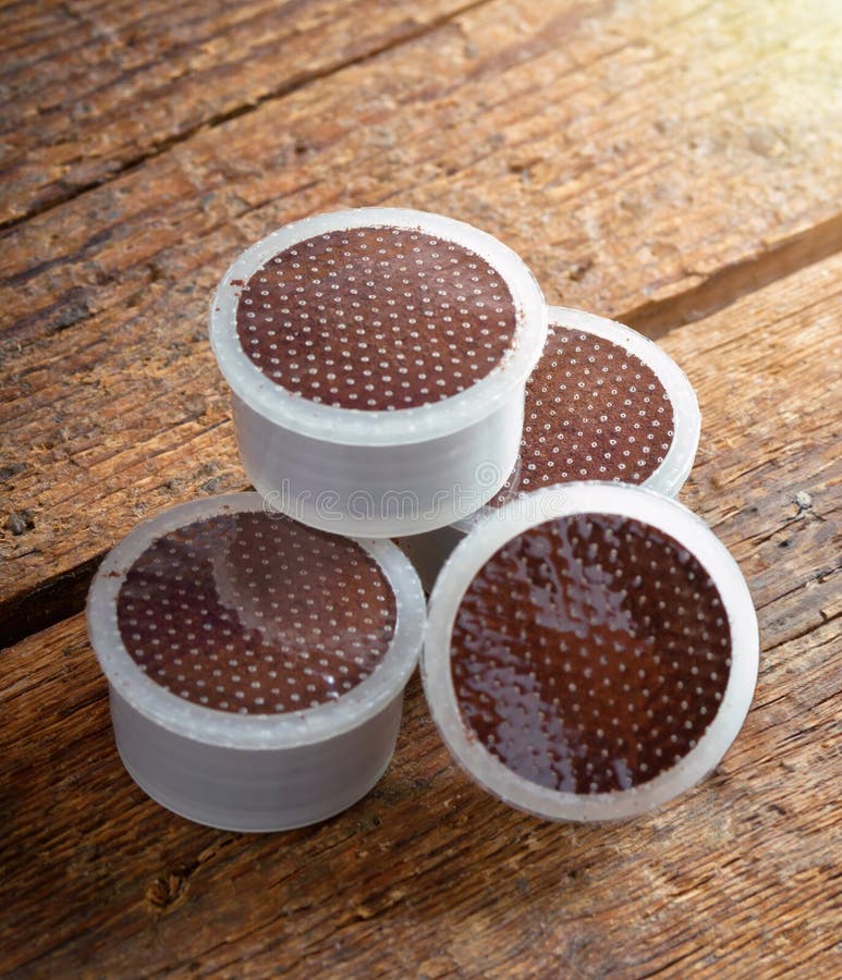 Coffee Pods Resting on a Rustic Wooden Surface Stock Photo - Image of ...