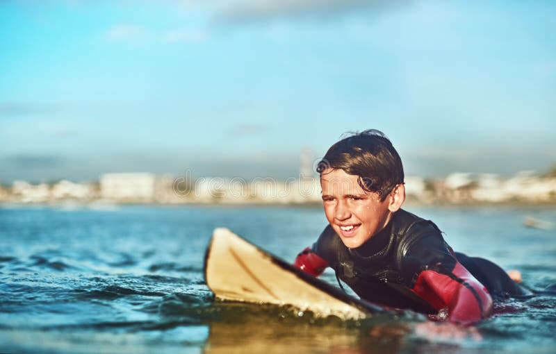Enjoy Life, One Wave at a Time. a Young Boy Out Surfing. Stock Photo ...