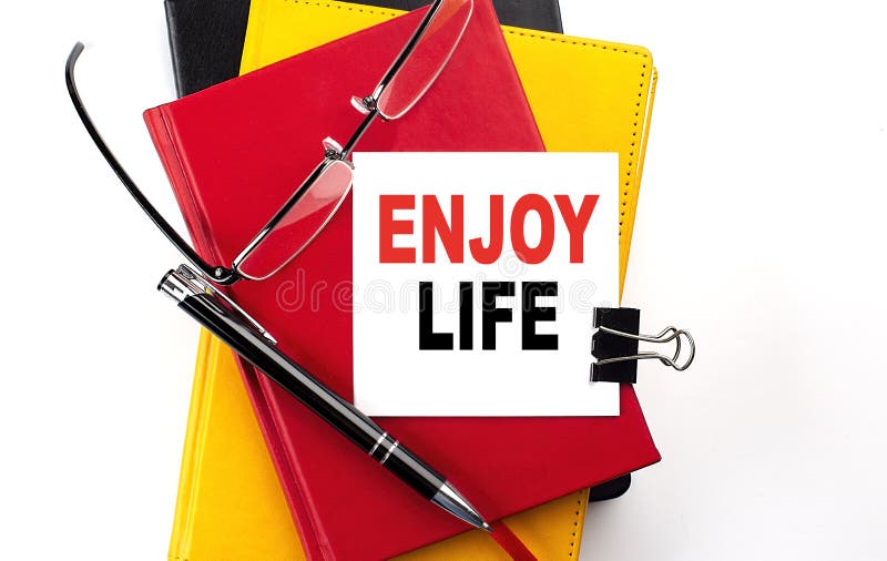 ENJOY LIFE Text Written on a Sticky on Colorful Notebooks Stock Photo ...
