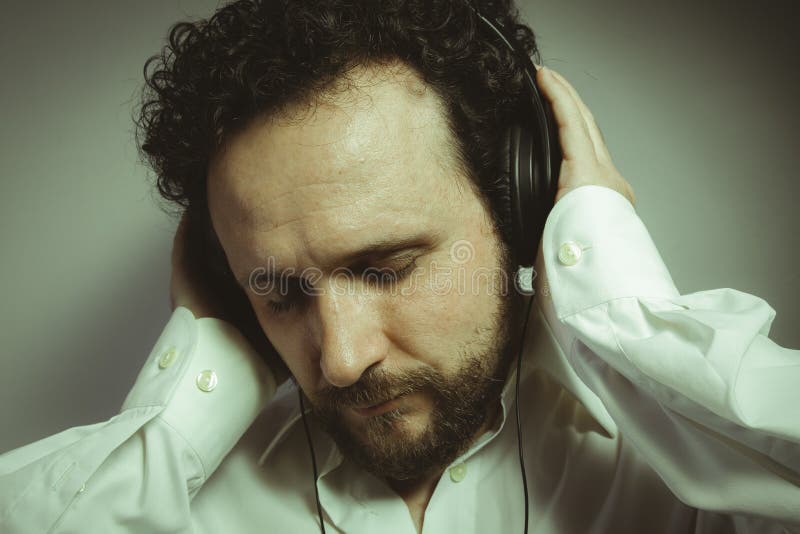 Enjoy the Music, Man with Intense Expression, White Shirt Stock Image ...