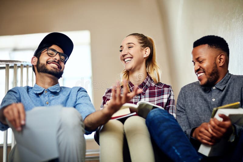 They Enjoy Studying Together. Three Young University Students Studying ...