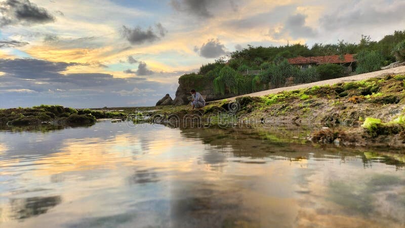 Enjoy the Sunset on the Beautiful in Sepanjang Beach Stock Photo ...
