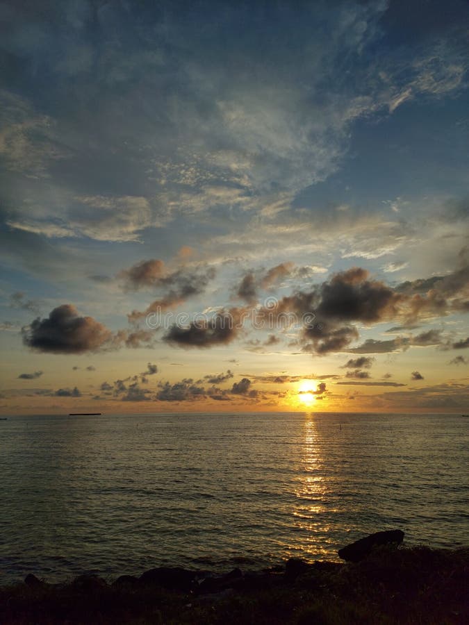 Enjoy the Sunset Sitting and Relaxing on the Beach with a Cool Breeze ...