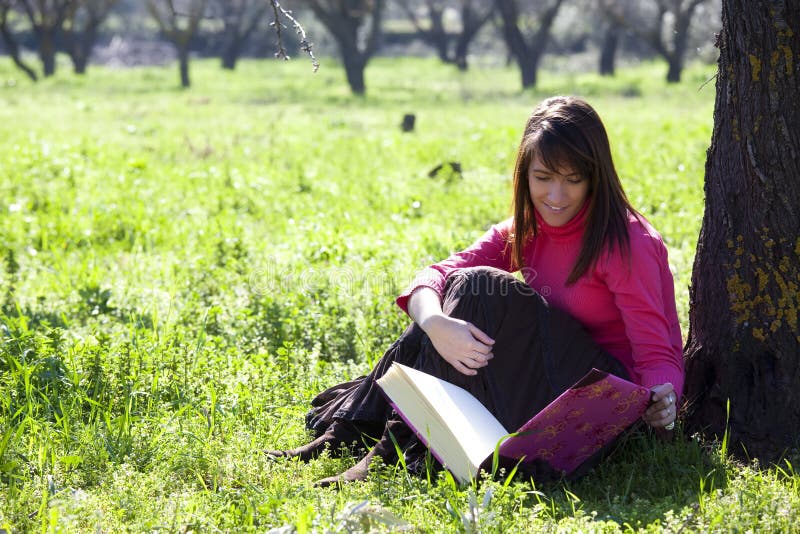 Enjoying a Book in the Forest Stock Image - Image of cute, females ...