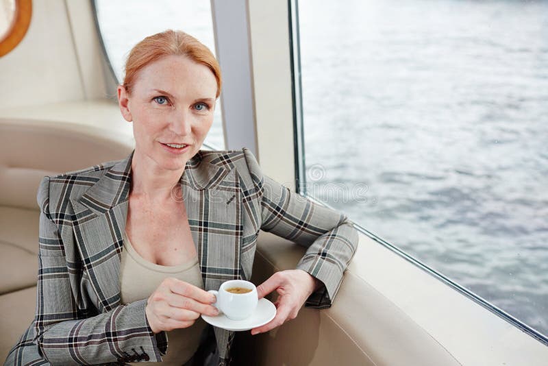 Enjoying Coffee at Middle Deck Stock Image - Image of businesswoman ...