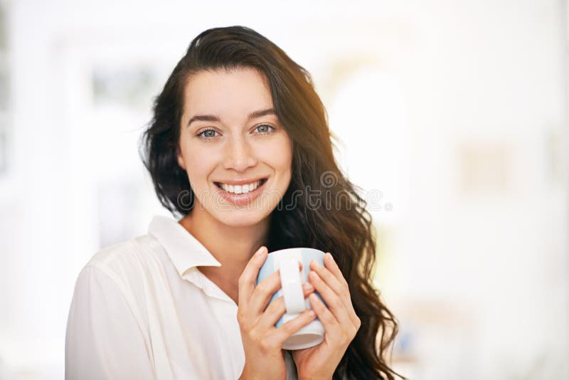 Enjoying a Cuppa Java Joy. Portrait of a Happy Young Woman Enjoying a Cup of Coffee. Stock Photo ...