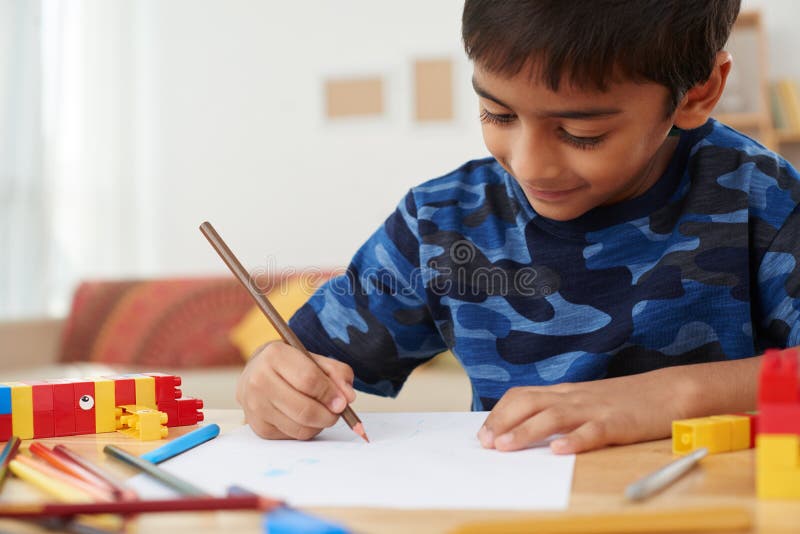 Enjoying drawing stock image. Image of sketching, youngster - 72599621