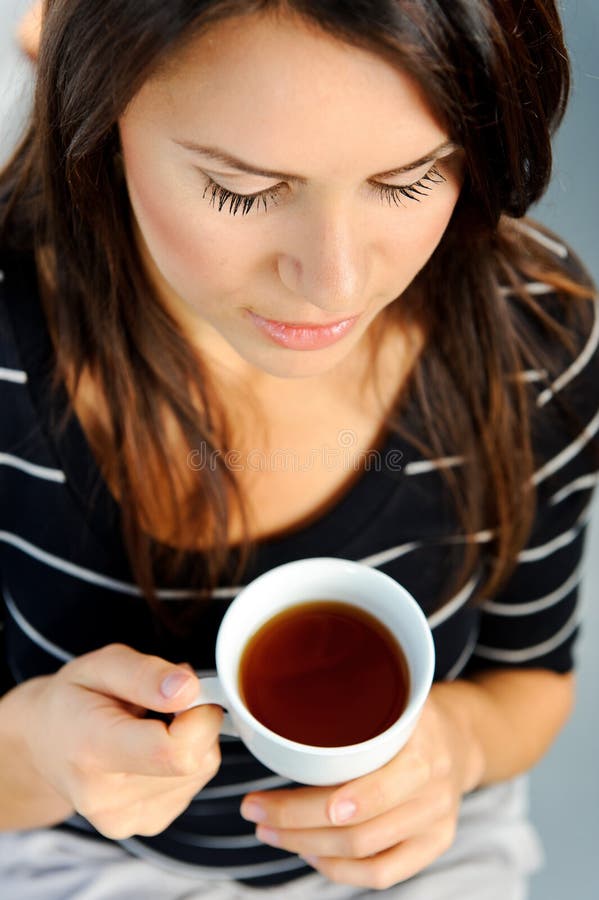 Enjoying her tea stock image. Image of female, beverage - 21792683