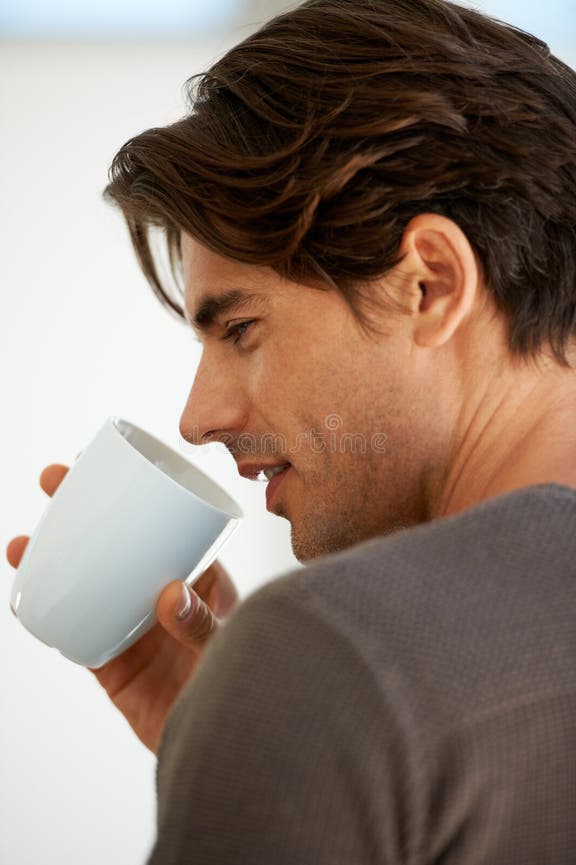 Enjoying His Morning Java. a Handsome Young Man Standing at Home and ...