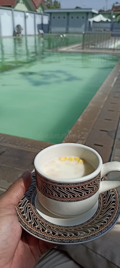 Enjoying Hot Milk with Corn in the Pool Side Stock Image - Image of ...