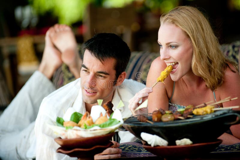 Enjoying Lunch stock photo. Image of female, relax, lying - 9199256