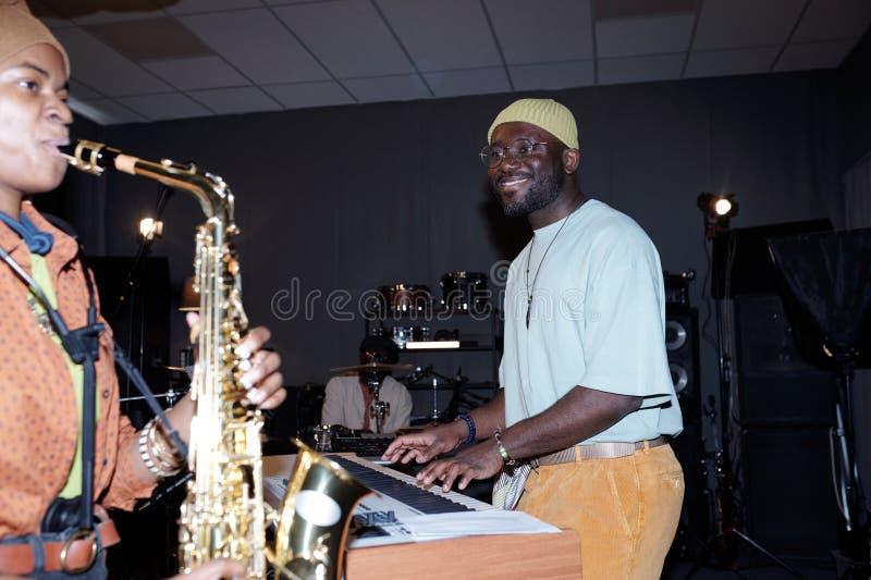 Enjoying Musical Performance with Group in Studio Setting Stock Image ...