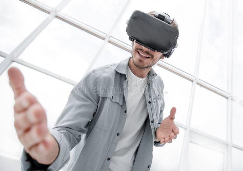 Enjoying New Reality. Attractive Young Man in VR Headset Gesturi Stock ...