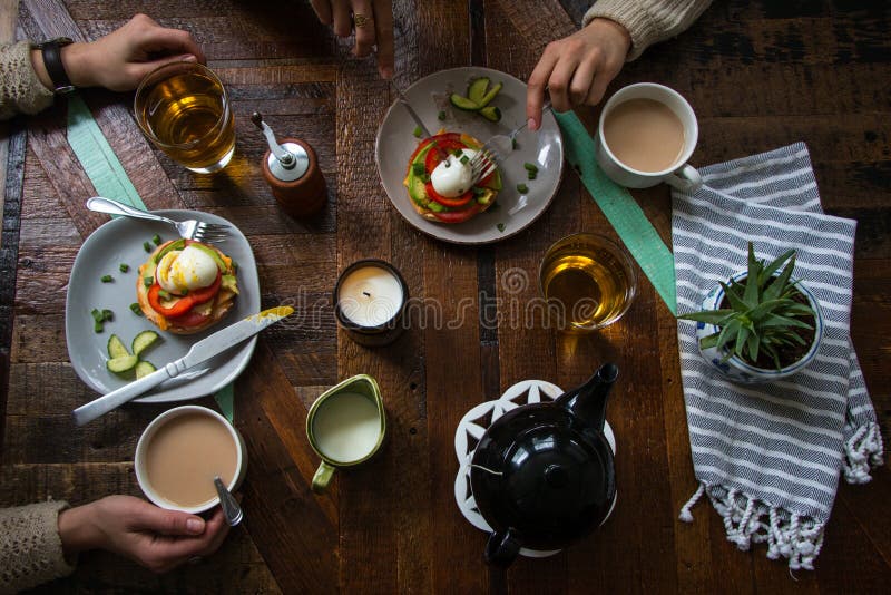 Enjoying a Simple Meal on a Wooden Table Stock Photo - Image of cloth ...