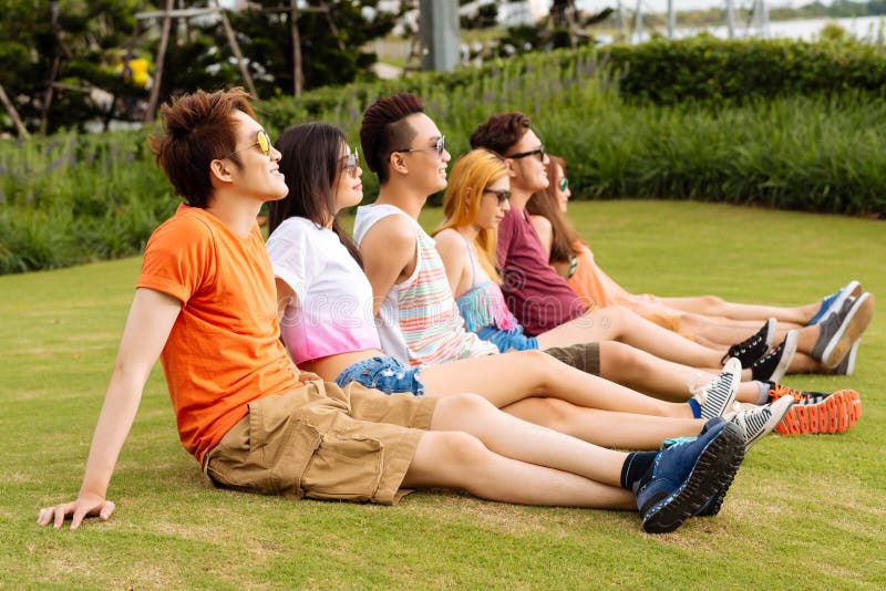 Enjoying the sunlight stock photo. Image of grass, people - 49539134