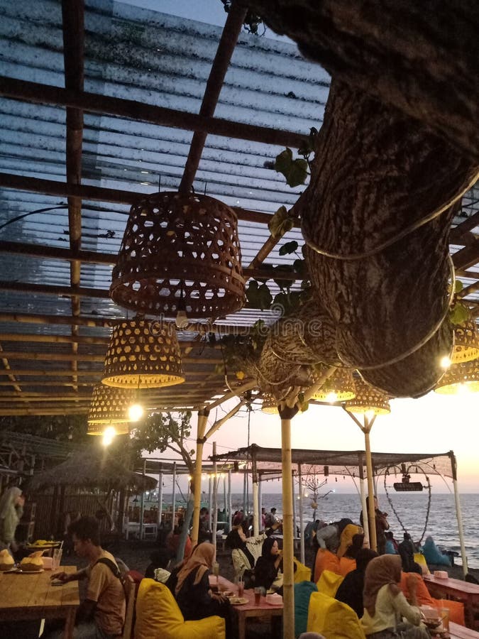 Enjoying the Sunset at a Beachside Cafe Editorial Photography - Image ...