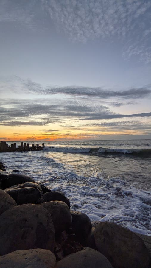 Enjoying the Sunset on the Indonesian Beach Stock Photo - Image of ...