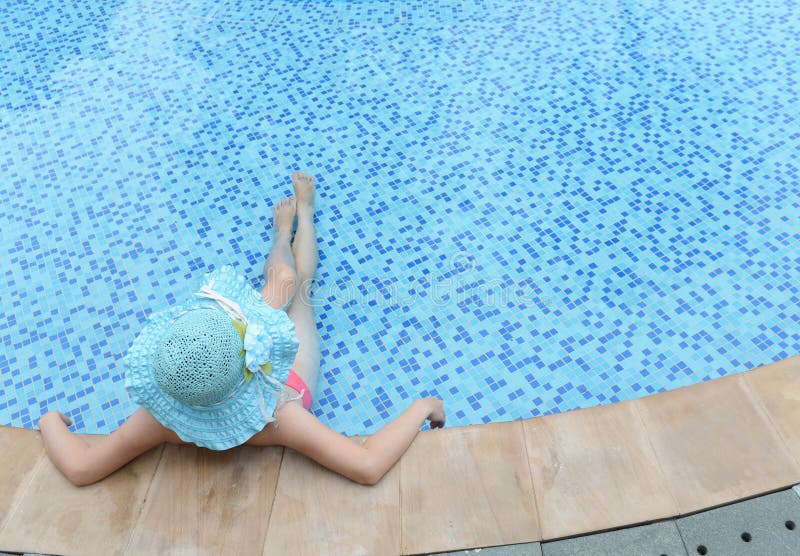 Enjoying a swimming pool stock image. Image of bright - 32191165